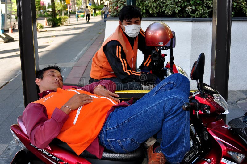 Bangkok, Thailand: Napping Motorcyclist Editorial Stock Image - Image ...