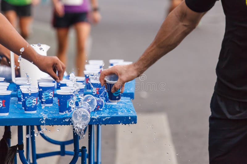 Marathon Racer Catching Cup of Water Stock Photo - Image of outdoor ...
