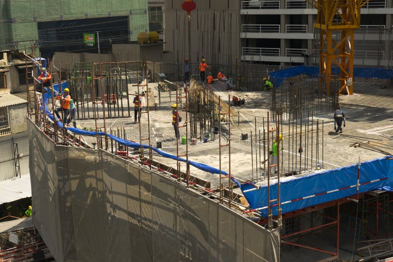 Unidentified Construction Workers Working at High Level of Construction ...