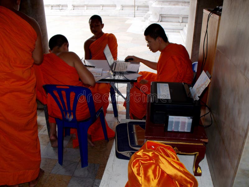 Young Buddhist Monks Study Using a Computer at a Temple in Bangkok ...