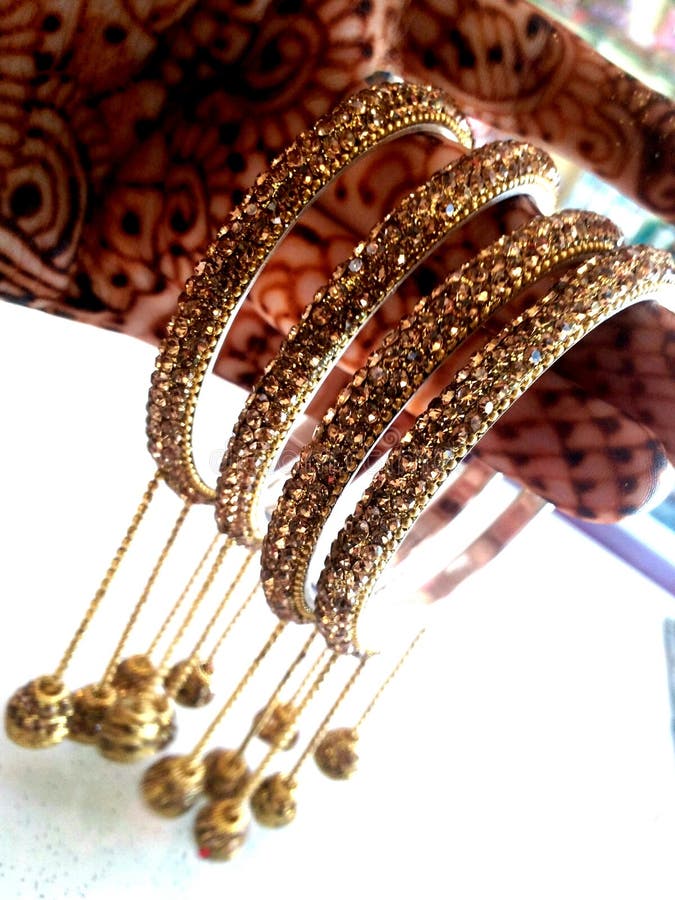 Bangles of golden colour stock image. Image of four - 167345097