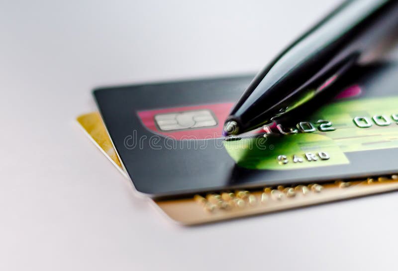 Bank Card with a Ballpoint Pen on the Table. Credit Card with a Pen ...