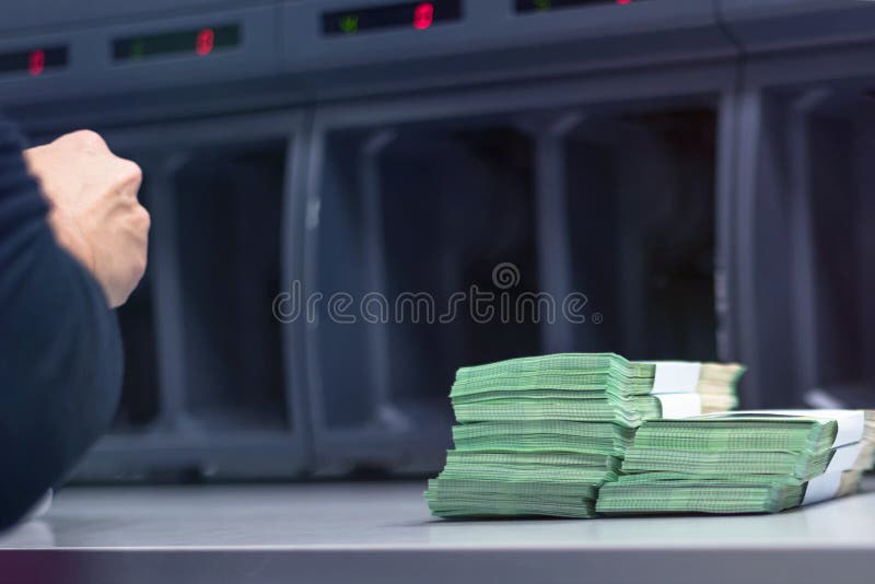 Bank Employees Sorting and Counting Money Inside Bank Vault. Large ...