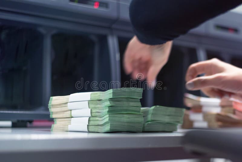 Bank Employees Sorting and Counting Money Inside Bank Vault. Large ...