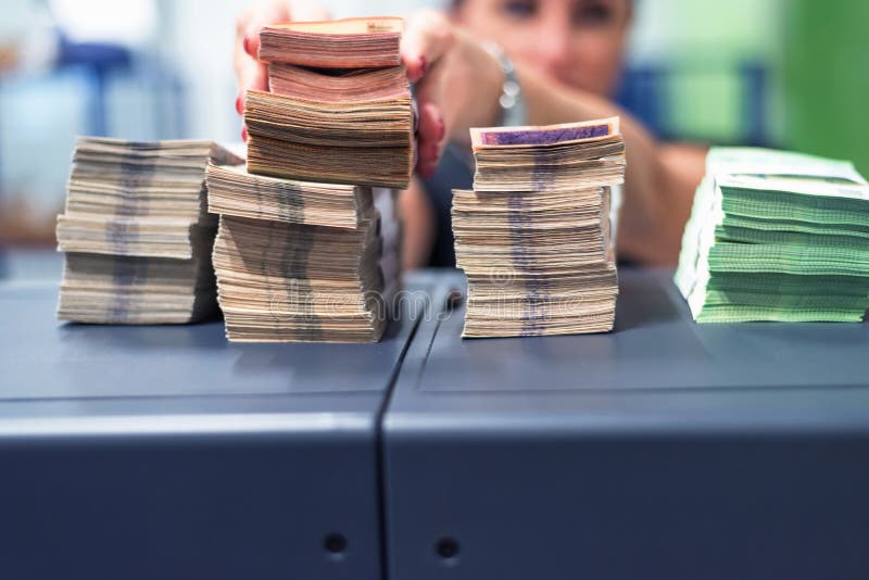 Bank Employees Sorting and Counting Money Inside Bank Vault. Large ...