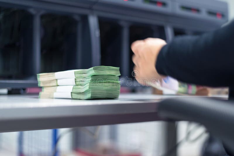 Bank Employees Sorting and Counting Money Inside Bank Vault. Large ...