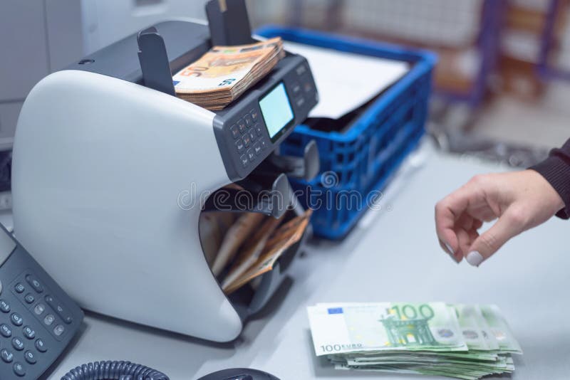 Bank Employees Sorting and Counting Money Inside Bank Vault. Large ...