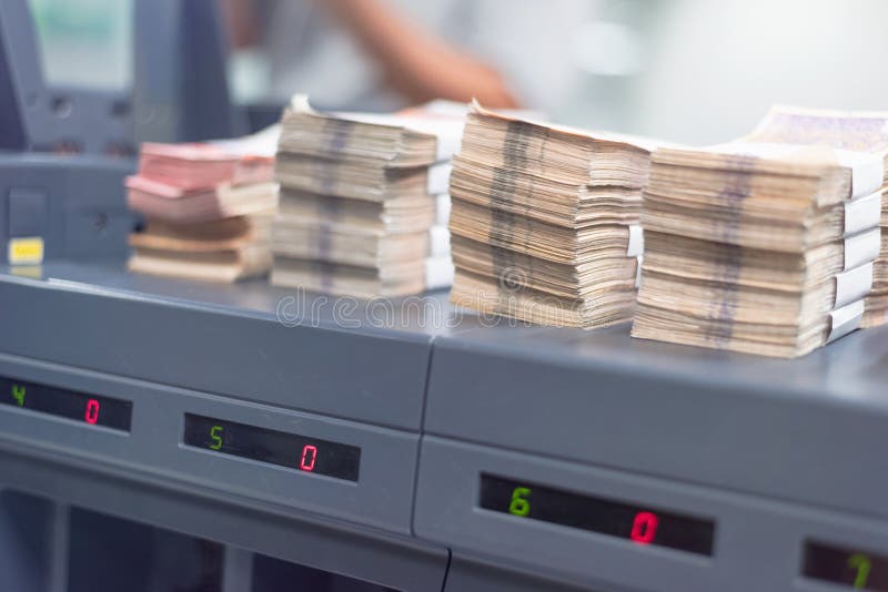 Bank Employees Sorting and Counting Money Inside Bank Vault. Large ...