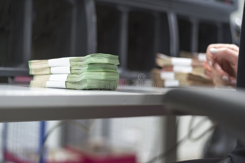 Bank Employees Sorting and Counting Money Inside Bank Vault. Large ...