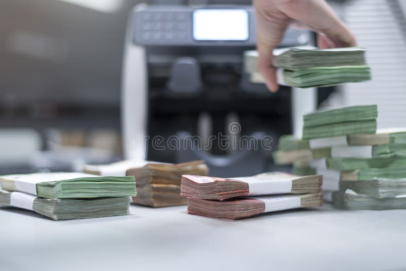 Bank Employees Sorting and Counting Money Inside Bank Vault. Large ...