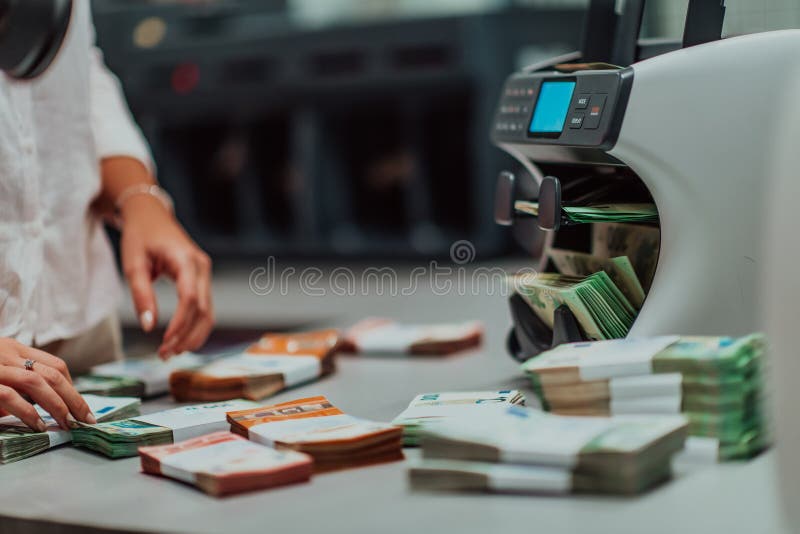 Bank Employees Using Money Counting Machine while Sorting and Counting ...