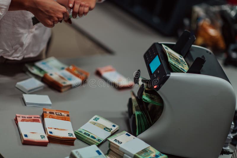 Bank Employees Using Money Counting Machine while Sorting and Counting ...