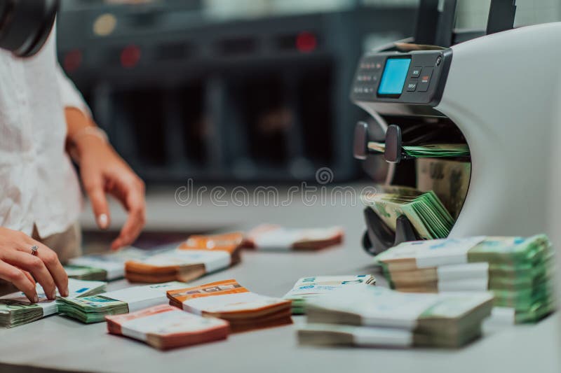 Bank Employees Using Money Counting Machine while Sorting and Counting ...