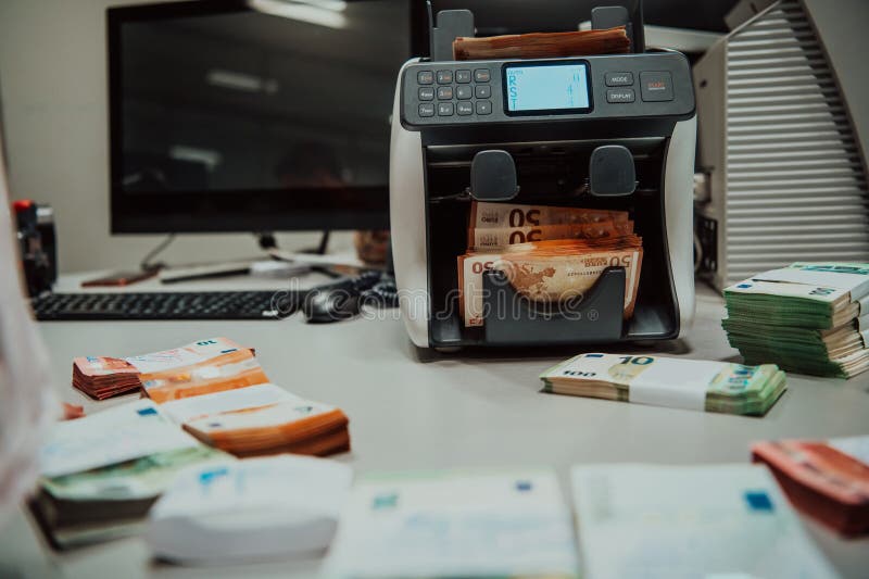 Bank Employees Using Money Counting Machine while Sorting and Counting ...