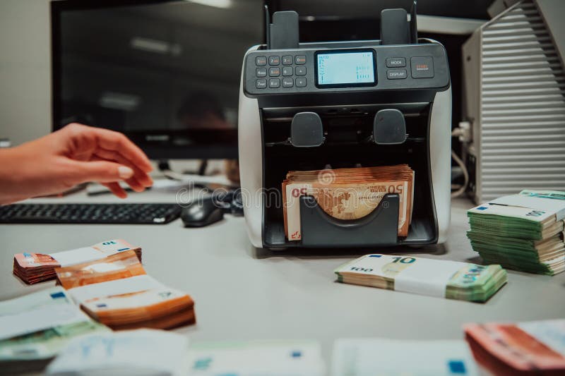 Bank Employees Using Money Counting Machine while Sorting and Counting ...