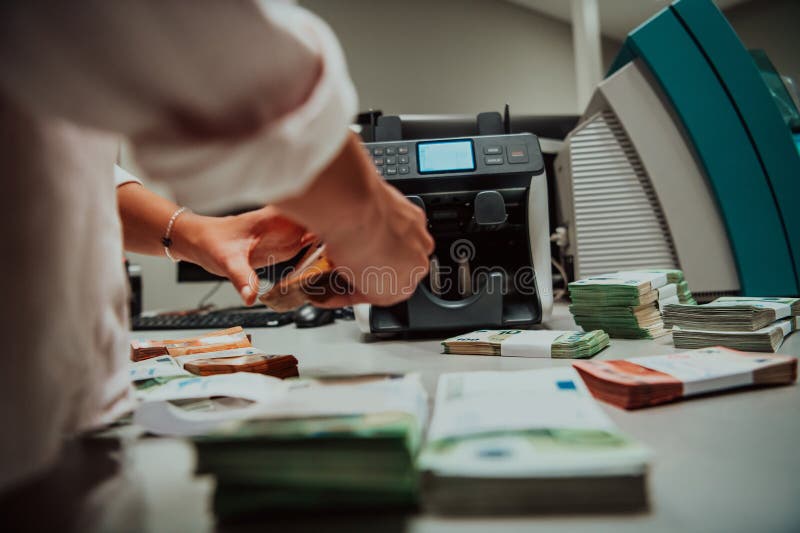 Bank Employees Using Money Counting Machine while Sorting and Counting ...