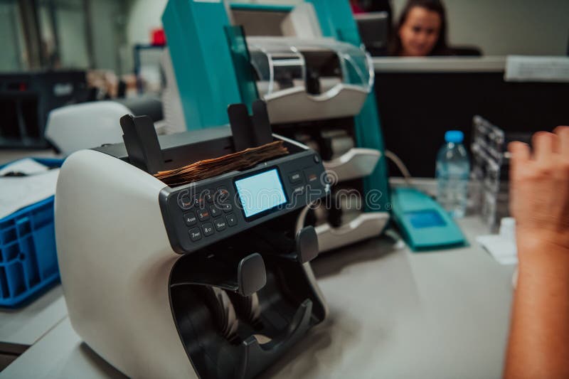 Bank Employees Using Money Counting Machine while Sorting and Counting ...