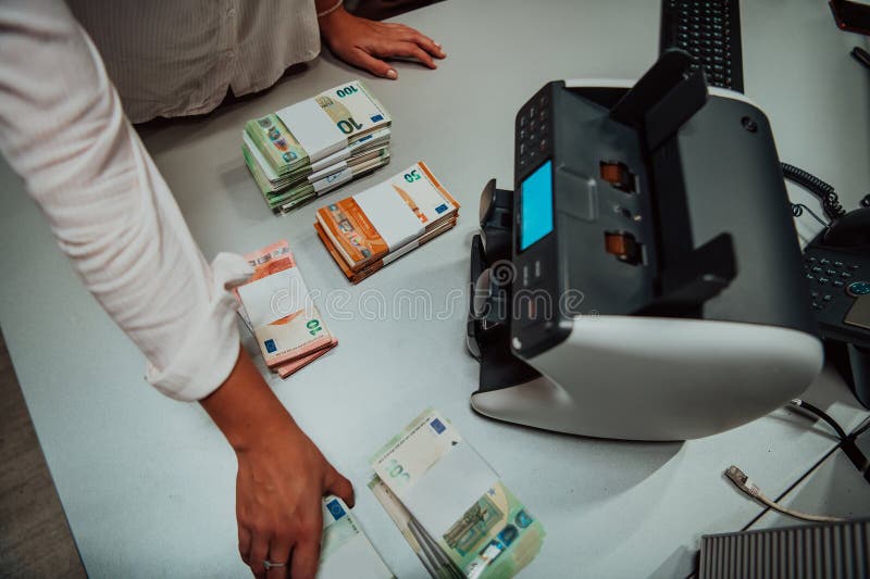 Bank Employees Using Money Counting Machine while Sorting and Counting ...