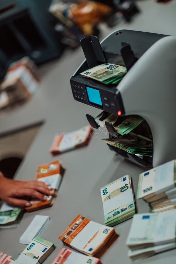 Bank Employees Using Money Counting Machine while Sorting and Counting ...