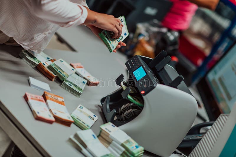 Bank Employees Using Money Counting Machine while Sorting and Counting ...