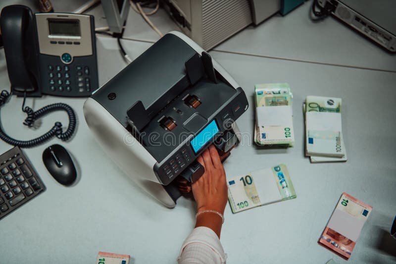Bank Employees Using Money Counting Machine while Sorting and Counting ...