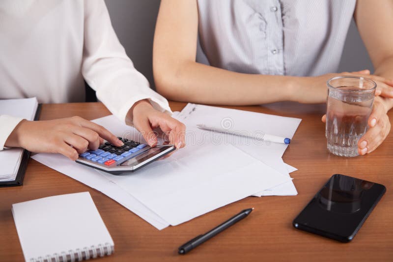 In the Bank, the Manager Consults with a Young Woman Stock Image ...