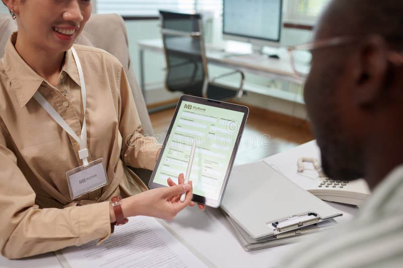 Bank Manager Showing Form To Client Stock Image - Image of consult ...