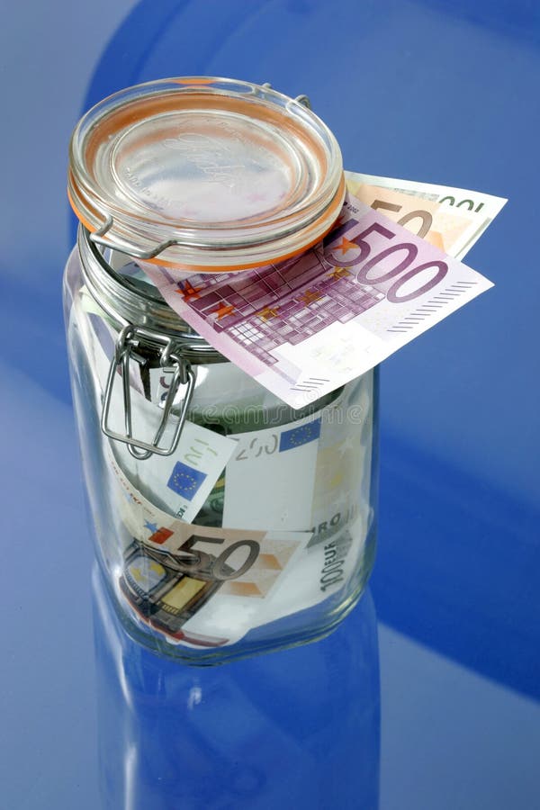 Bank notes in a glass jar stock image. Image of bank - 11645705