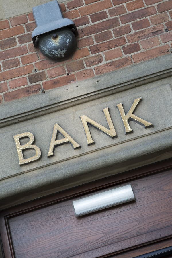 Bank Sign stock image. Image of gold, wall, door, brick - 87849825