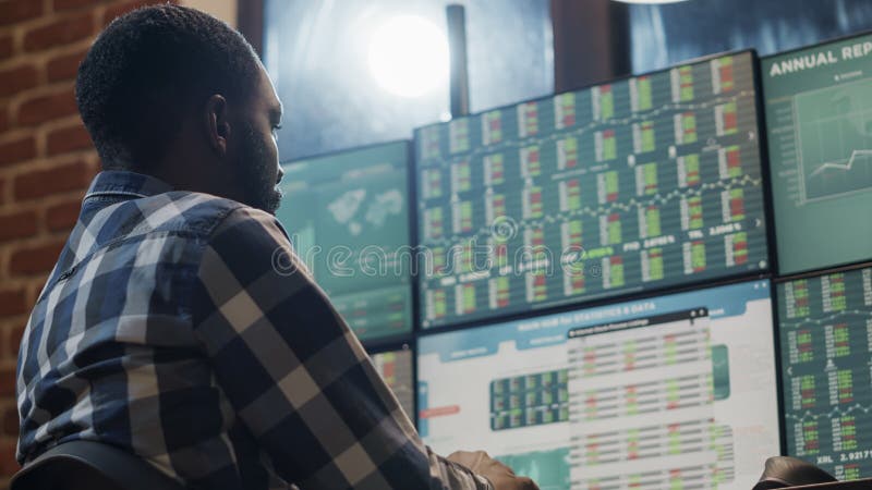 Bank Trader Analyzing Stock Market Statistics on Multi Monitors Stock ...