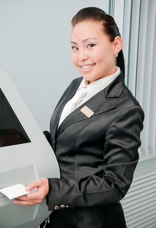 Bank worker by an ATM stock image. Image of lady, machine - 65898999