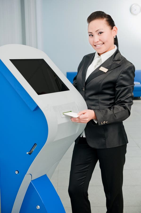 Bank worker by an ATM stock image. Image of happy, lady - 65977753