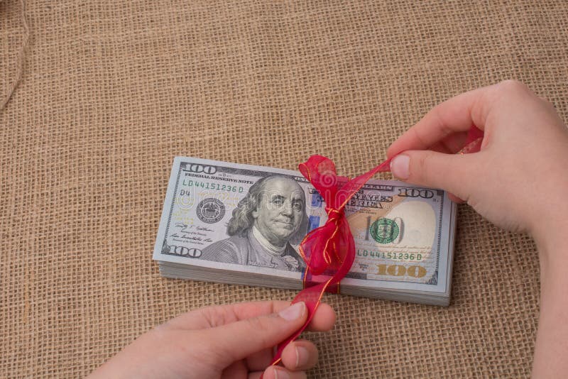 Banknote Bundle of US Dollar Tied with a Ribbon Stock Photo - Image of ...
