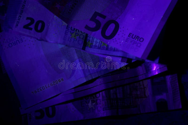 Banknotes in UV light. stock photo. Image of change - 109629102