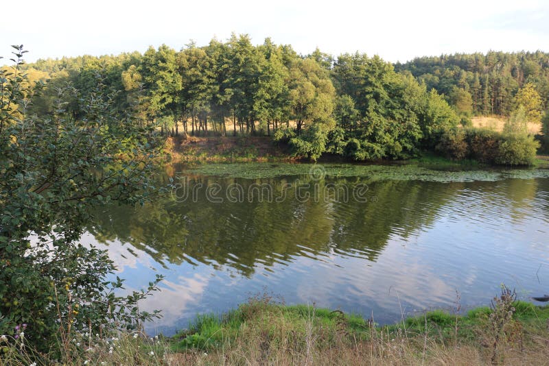 The Banks of a Flat River Invite To Travel Stock Photo - Image of blue ...