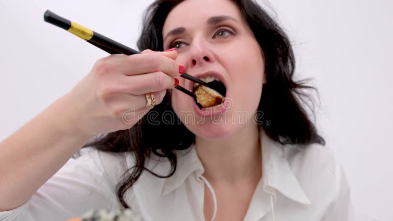 Banner Beautiful Brunette Eating Sushi with Chopsticks Close-up Face ... Banner Beautiful Brunette Eating Sushi with Chopsticks Close-up Face ...