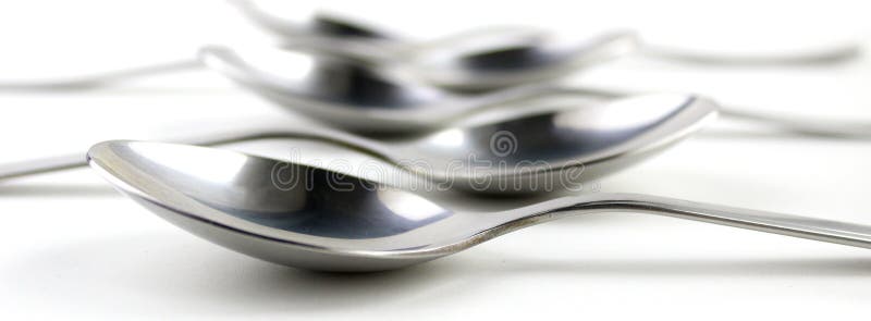 Banner. Stainless Cutlery Spoons on the White Background. Stock Image ...
