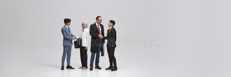 Banner. Two Formally Dressed Men Engage in Handshake Against White ...