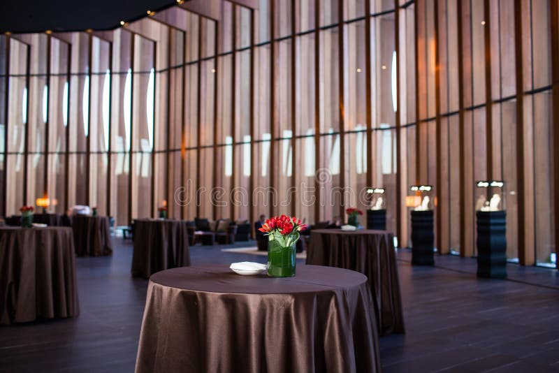 Banquet Hall with High Ceilings and Covered Tables Stock Image - Image ...