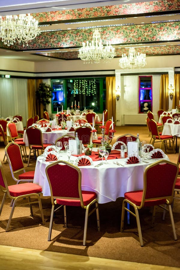 Banquet with Red Table Setting Tablecloth White Dishes Silver Cutlery ...