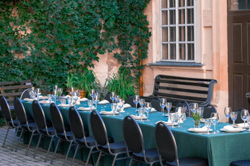 Banquet Table Dishes Plates and Goblets in Back Yard Outdoor Space ...