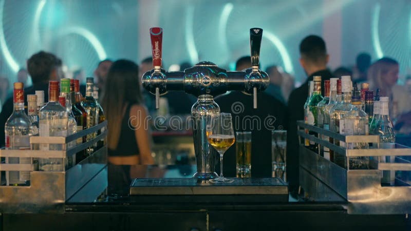 A Bar with Alcoholic Drinks and a Beer Dispenser. Stock Footage - Video ...