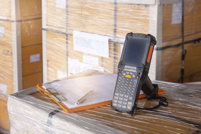 Bar Code Scanner and Clipboard on Cardboard Cargo Boxes. Computer Tools ...