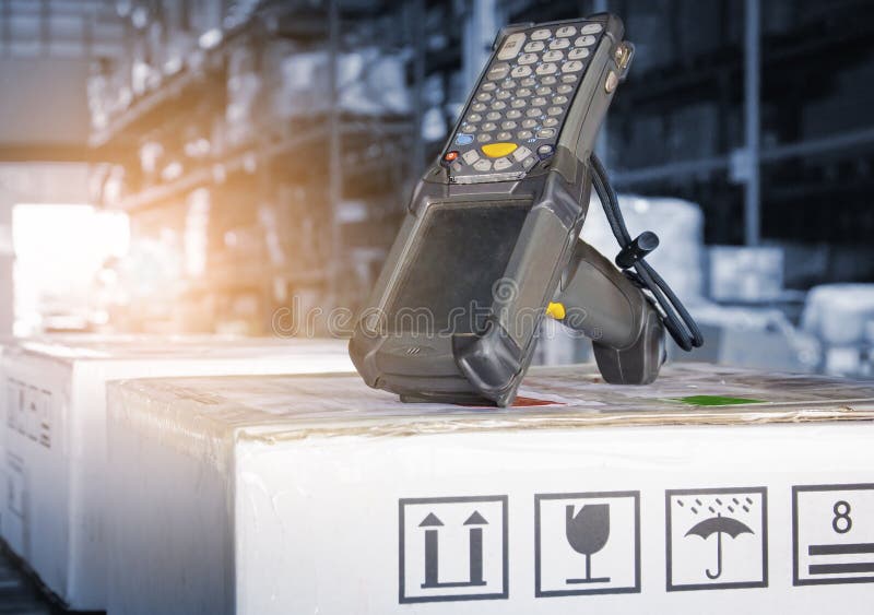 Bar Code Scanner on Package Boxes at Storage Warehouse. Computer Work ...