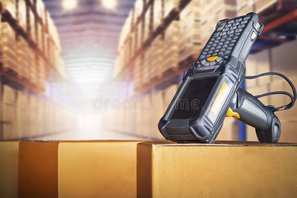 Bar Code Scanner on Packaging Boxes in Storage Warehouse. Shipping ...