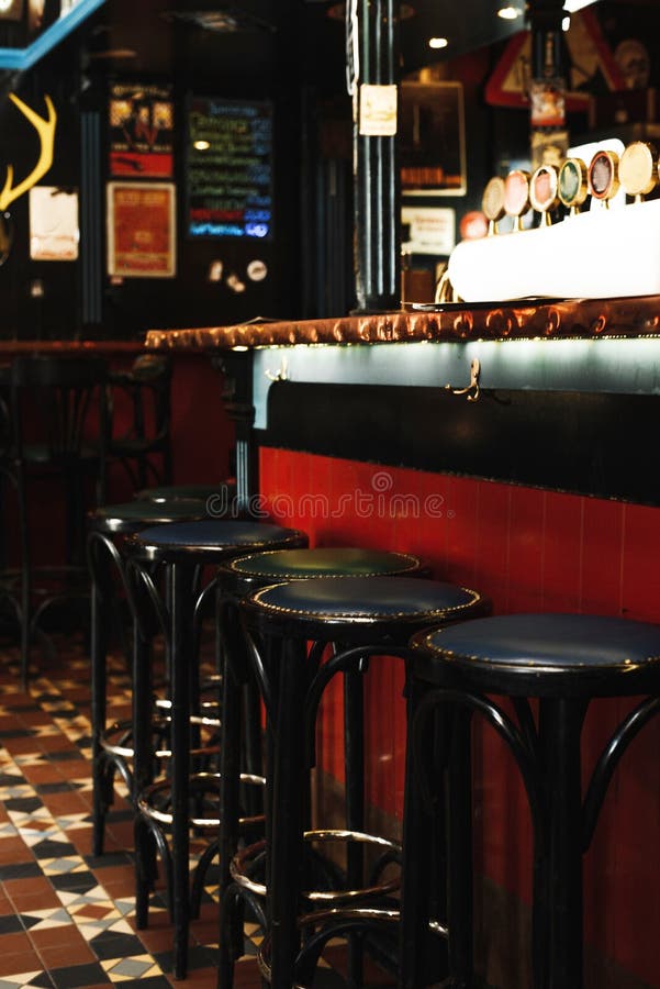 Bar Counter and Chairs in the Pub. Empty Bar with Beautiful Light ...