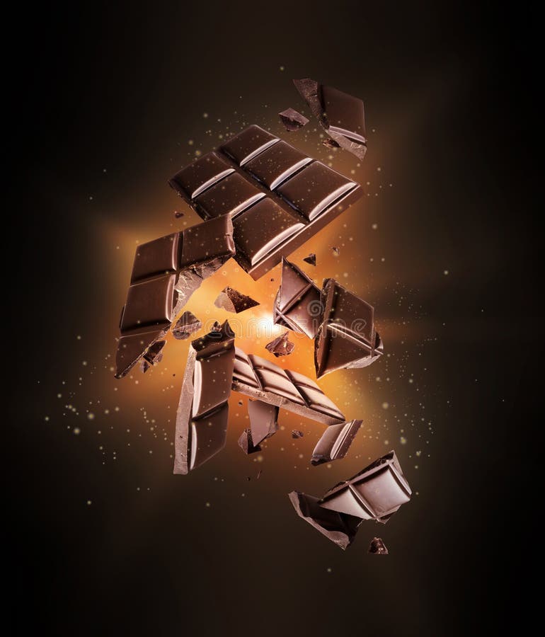 Bar of Dark Chocolate Crushed in the Air with Flash of Light in the ...