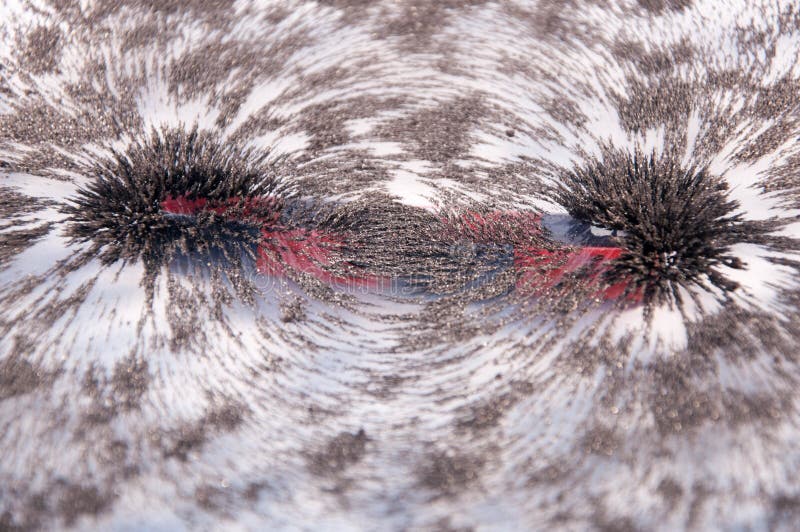 Iron Dust Showing The Magnetic Field Near A Magnet Bar On White ...