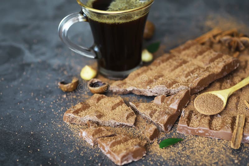 A Bar of Milk Chocolate on the Table. Chocolate with Nuts and Cinnamon ...