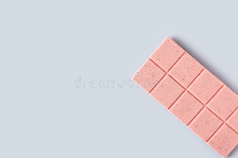 Bar of Pink Chocolate Flat Lay on Blue Background Stock Photo - Image ...